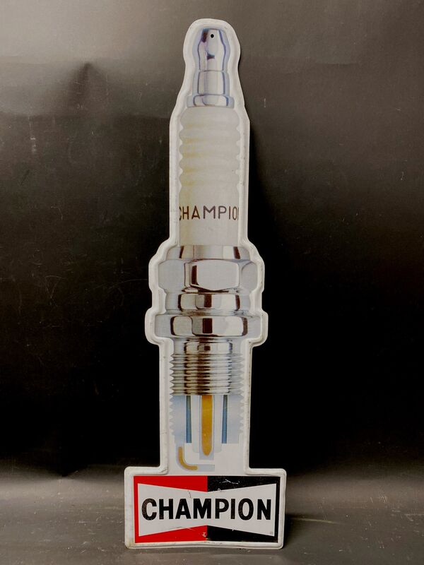 A Champion Spark Plug-Shaped Tin Advertising Sign. # | XXXX Antique Complex
