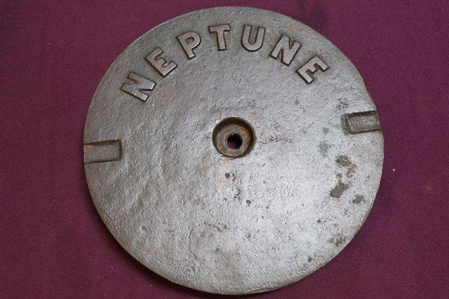 Embossed Neptune Cast Iron Tank Cover | XXXX Antique Complex