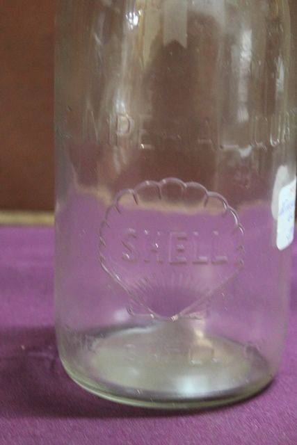Quart Shell Embossed Oil Bottle with Tin Top | XXXX Antique Complex